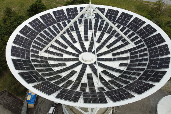 Switzerland - Solar array in massive satellite dish supplies data centre